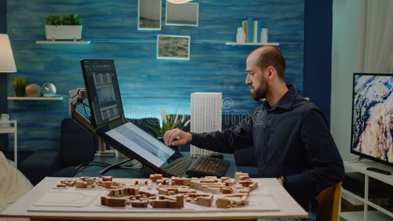 Architect Analyzing Building Model on Touch Screen Monitor Stock Photo ...