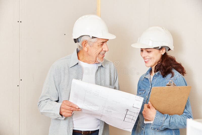 Architect with Architectural Drawing and Apprentice Stock Photo - Image ...