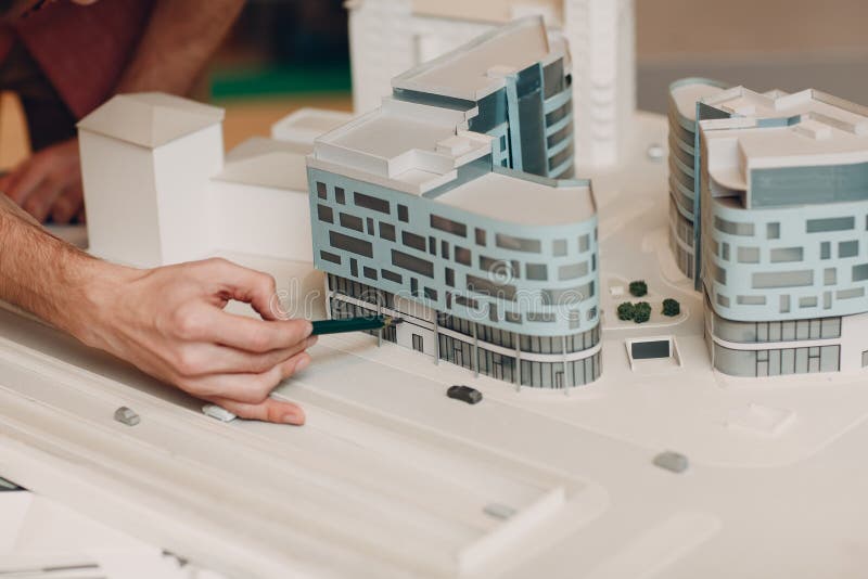 Architect with Blueprints and Layout Design Project at Office Stock ...