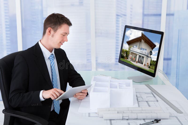 Architect Browsing Property on Computer in Office Stock Image - Image ...
