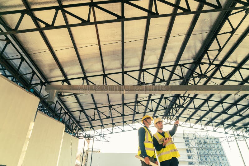 Architect and Builder with Computer Laptop Discussion Planning on ...