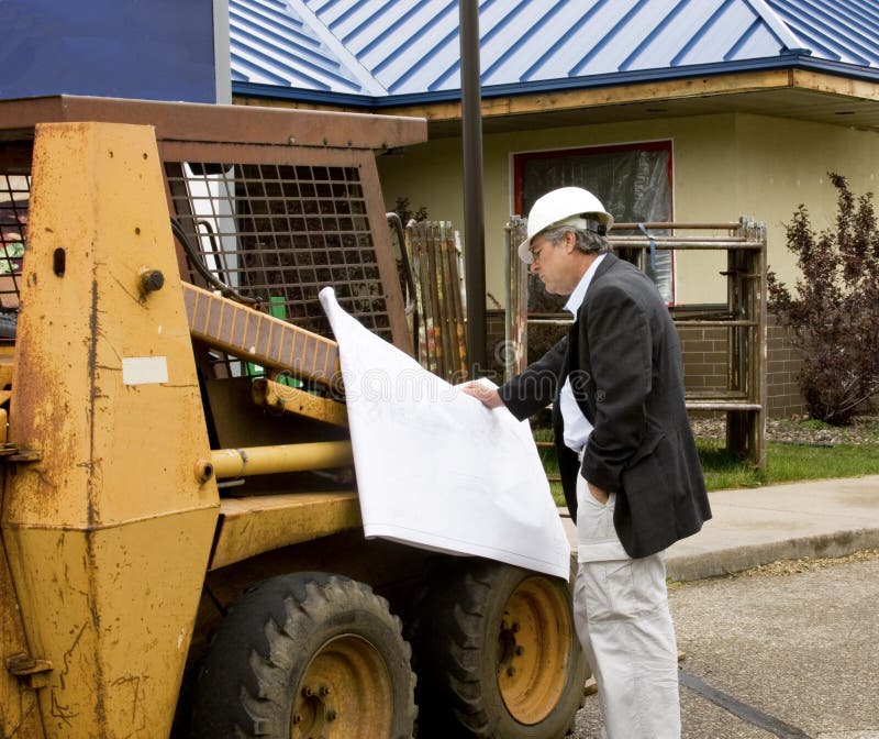 Architect Builder Reading Blueprints Stock Photo - Image of schematics ...
