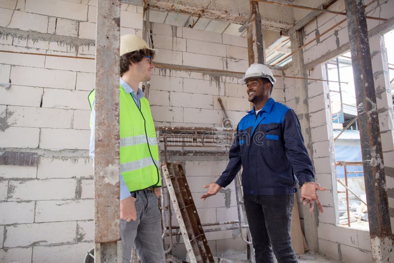 Architect and Builder Talking and Inspector Construction at ...