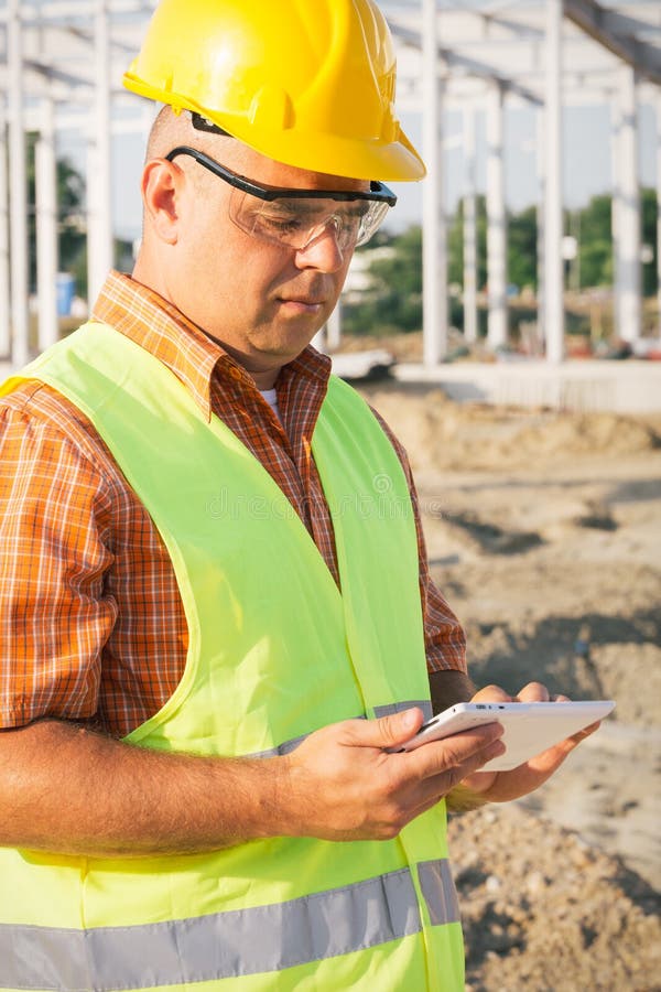 Architect on Building Site Using Digital Tablet Stock Image - Image of ... Architect on Building Site Using Digital Tablet Stock Image - Image of ...