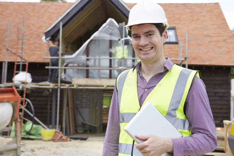 Architect on Building Site Looking at House Plans Stock Photo - Image ...