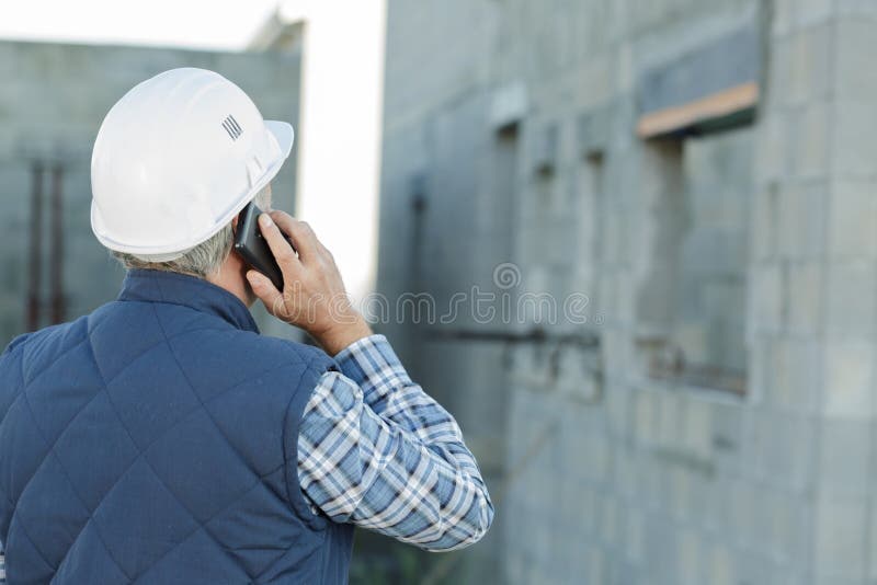 Architect on Building Site Using Mobile Phone Stock Photo - Image of ... Architect on Building Site Using Mobile Phone Stock Photo - Image of ...