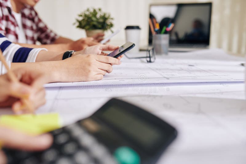 Architect Checking Text Messages Stock Photo - Image of females, adult ...
