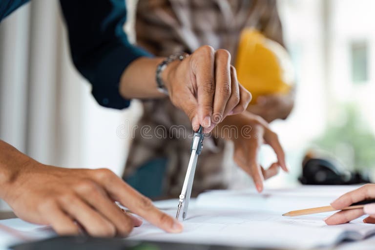 Architect Collaboration on Blueprint Design with Compass and Plans in ...