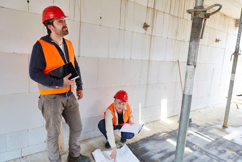 Architect and Construction Expert in the Shell Construction Stock Photo ...