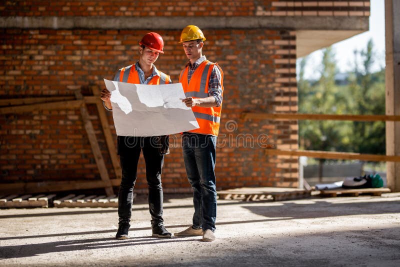Architect and Construction Manager Dressed in Orange Work Vests and ...