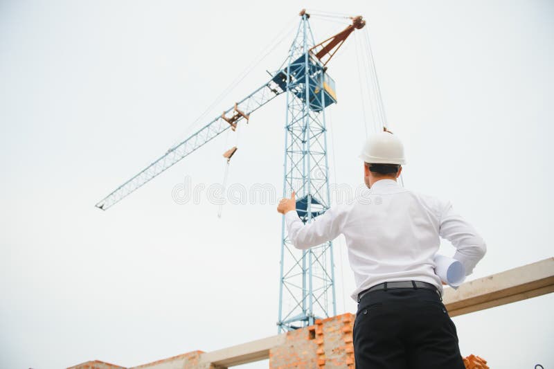 Architect at a Construction Site with Blueprints Stock Image - Image of ...