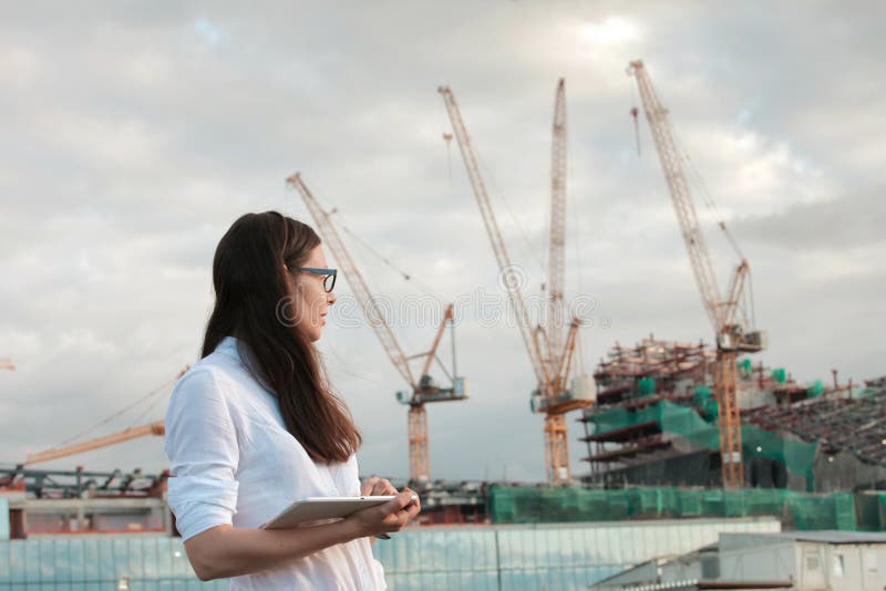 Architect on the Construction Site Makes Supervision. Young Woman ...