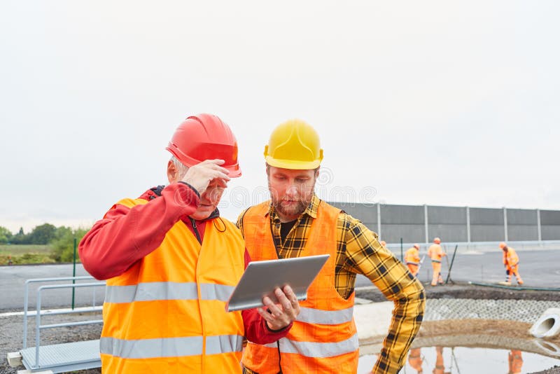 Architect And Construction Worker With Tablet Computer Stock Image ...