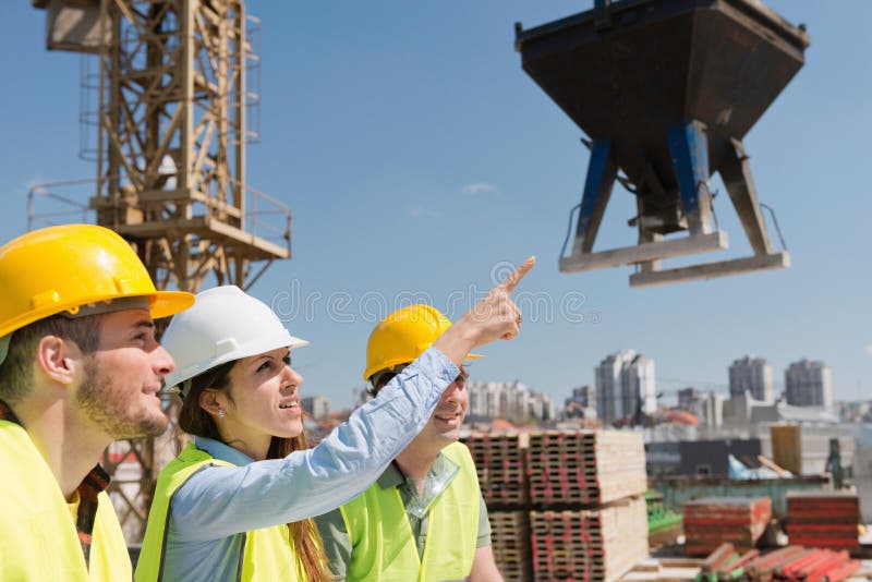 Architect with Construction Workers Stock Image - Image of pointing ...