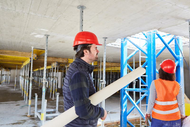 Architect and Craftsman in the Shell of the Construction Site Stock ...
