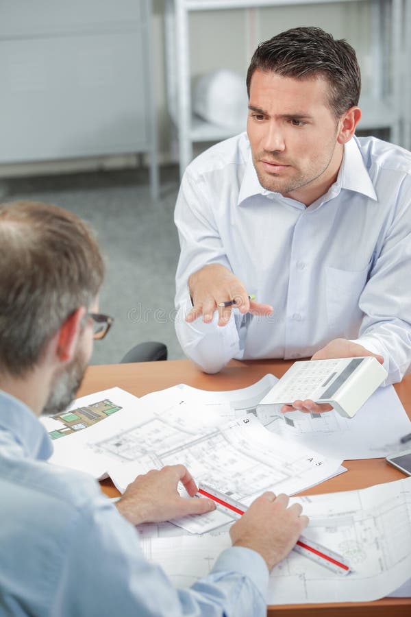 Architect Crunching Numbers during Meeting Stock Photo - Image of ...