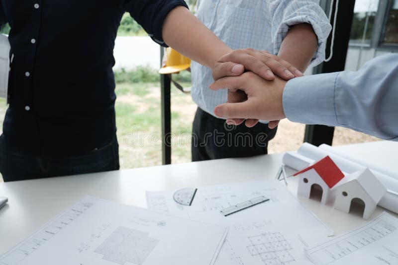 Architect & Customer Joining Hands. Engineer Put Hand Together W Stock ...