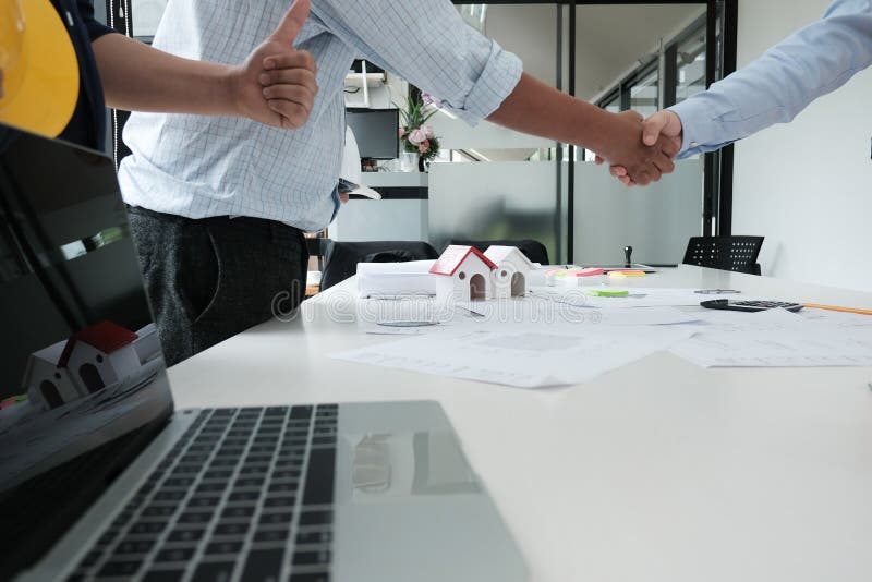 Architect & Customer Shaking Hands. Engineer Handshaking with Pa Stock ...