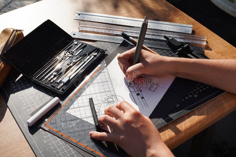 Architect and Designer Working Accurately on a Project Drawing Sketches ...