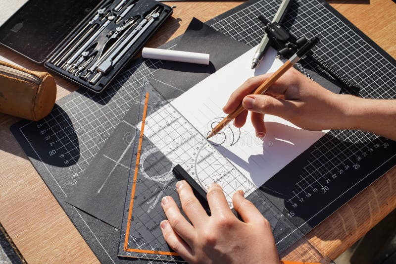 Architect and Designer Working Accurately on a Project Drawing Sketches ...