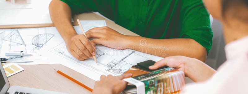 Architect Drafts Blueprint while Interior Design Choose Color ...