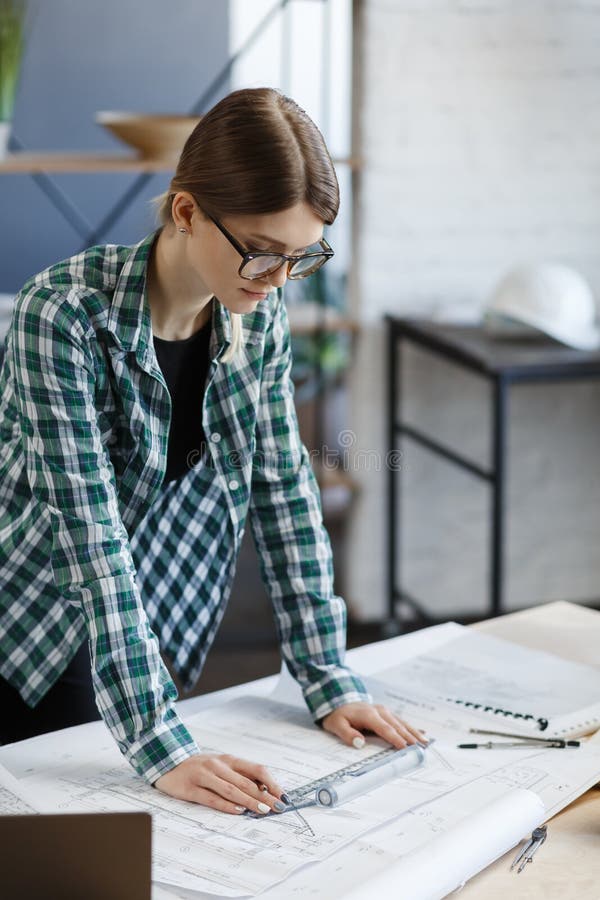 Architect Drawing Blueprints in Office. Engineer Sketching a ...