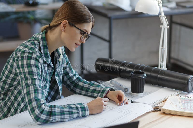 Architect Drawing Blueprints in Office. Engineer Sketching a ...