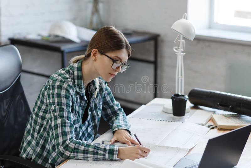 Architect Drawing Blueprints in Office. Engineer Sketching a ...
