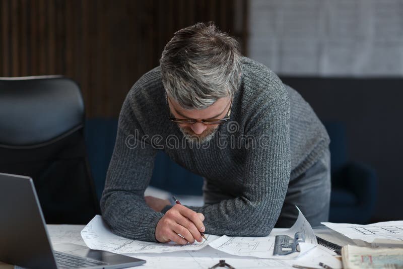 Architect Drawing Blueprints in Office. Engineer Sketching a ...