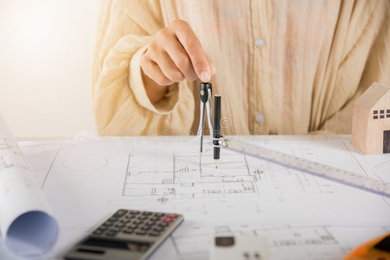 Architect Drawing with Divider Compass on House Plan Blueprint Paper ...