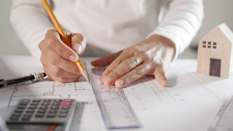 Architect Drawing with Ruler on House Plan Blueprint Paper for Repair ...