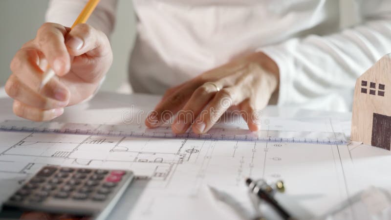 Architect Drawing with Ruler on House Plan Blueprint Paper for Repair ...