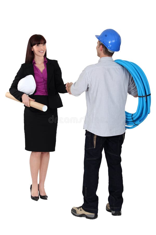 Electrician and Engineer Shaking Hands in Front of Electrical System ...