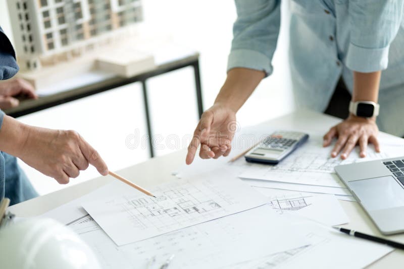 Architect or Engineer in Brainstorm Meeting is Pointing Out Design ...