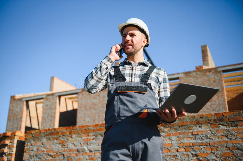 Architect or Engineer on Construction Site with Laptop Monitoring ...