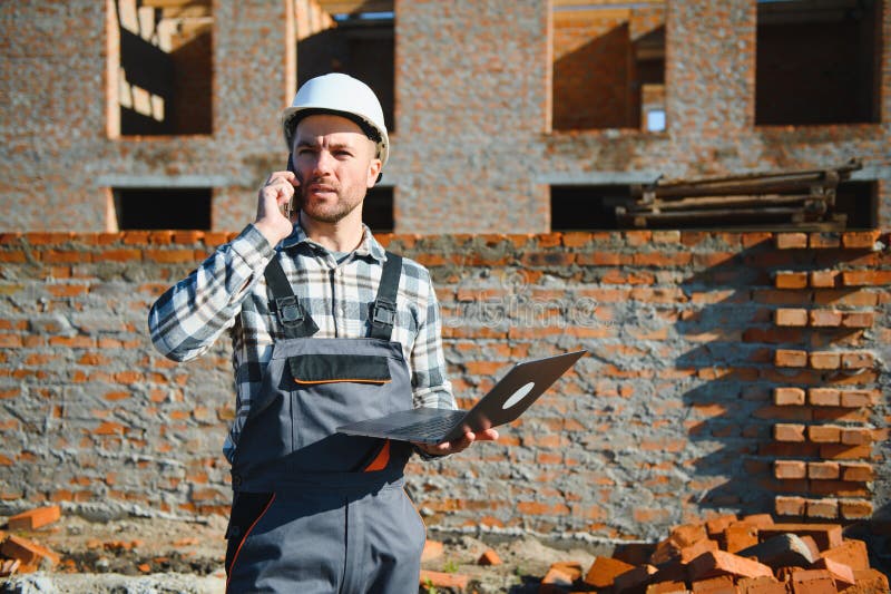 Architect or Engineer on Construction Site with Laptop Monitoring ...