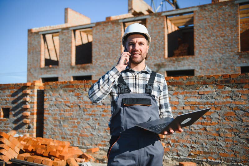Architect or Engineer on Construction Site with Laptop Monitoring ...