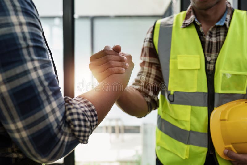 Architect and Engineer Construction Workers Shaking Hands after Finish ...