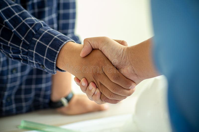 Architect and Engineer Construction Workers Shaking Hands after ...