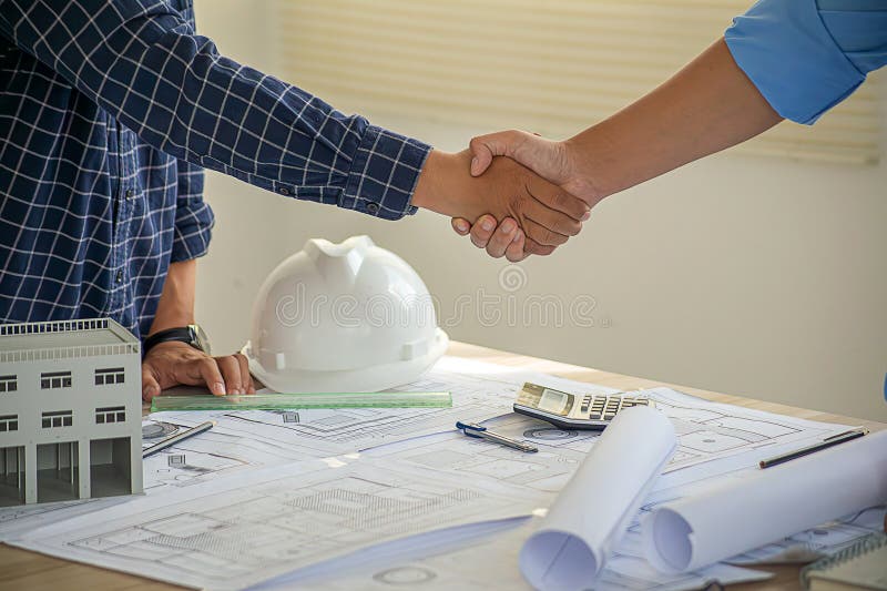 Architect and Engineer Construction Workers Shaking Hands after ...