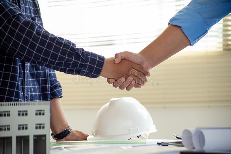 Architect and Engineer Construction Workers Shaking Hands after ...