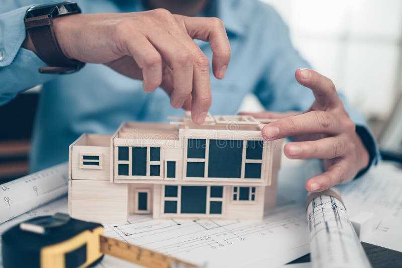 Architect Engineer Design House Model on Blueprint. House Planning ...