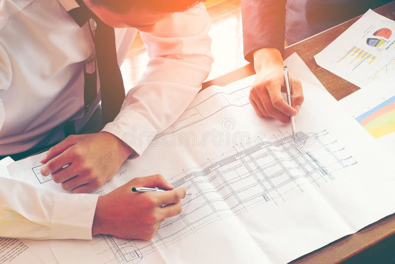 Architect and Engineer Discuss with Blue Print Construction Drawing on ...