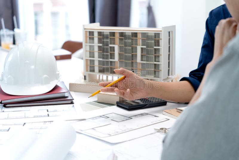 Architect Engineer Discussing Viewing Editing Plans Stock Photos - Free & Royalty-Free Stock ...