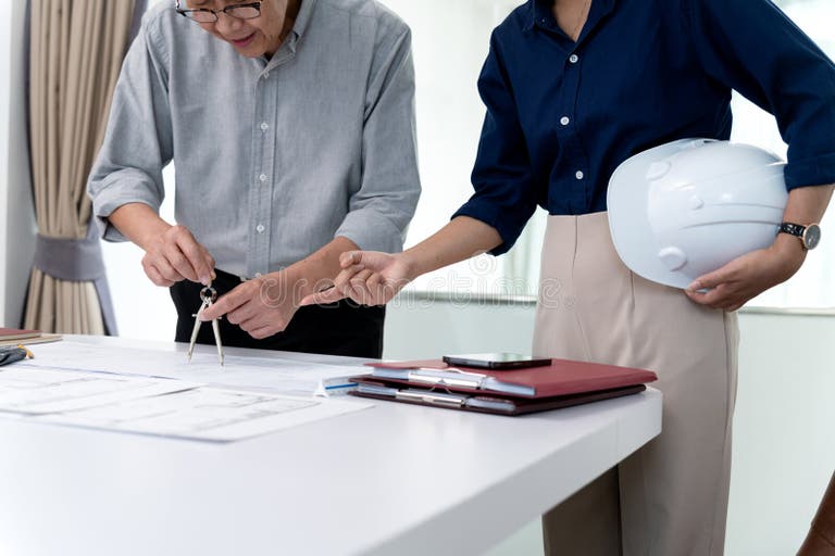 Architect and Engineer are Discussing and Viewing and Editing Plans Stock Photo - Image of ...