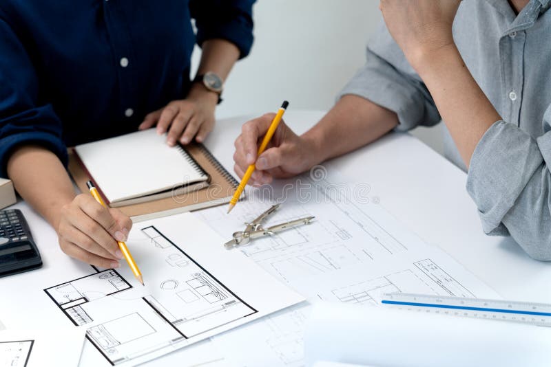 Architect and Engineer are Discussing and Viewing and Editing Plans Stock Image - Image of ...