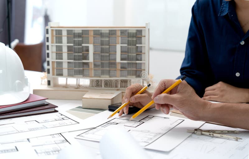 Architect and Engineer are Discussing and Viewing and Editing Plans ...