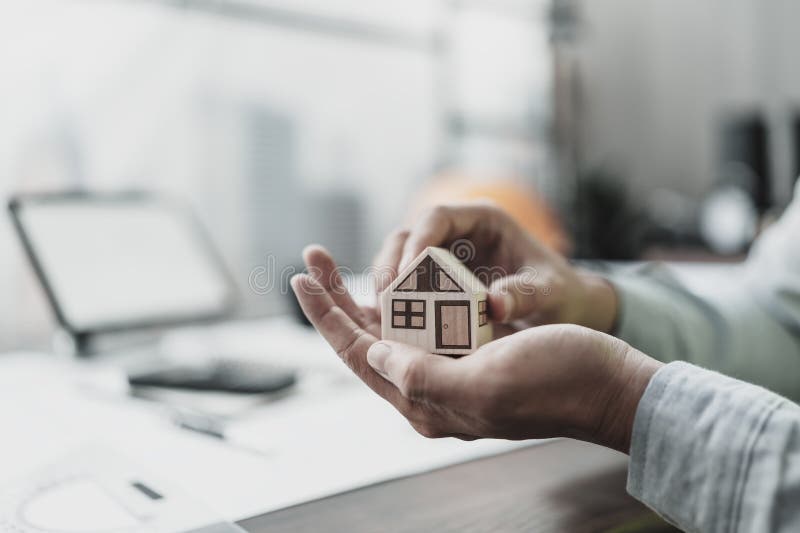 Architect Engineer Hands Hold and Protect Mini House Model on Blueprint ...