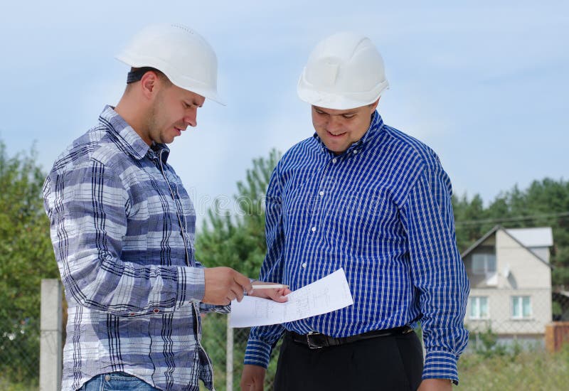 Architect and Engineer Having a Discussion Stock Photo - Image of ...