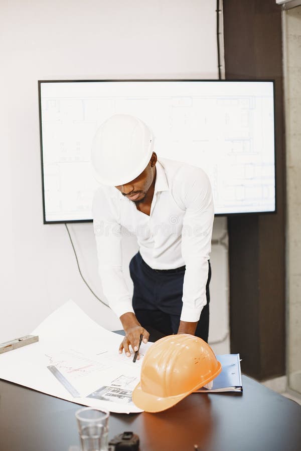 Young Manager in the Office with Helmet Stock Photo - Image of ...